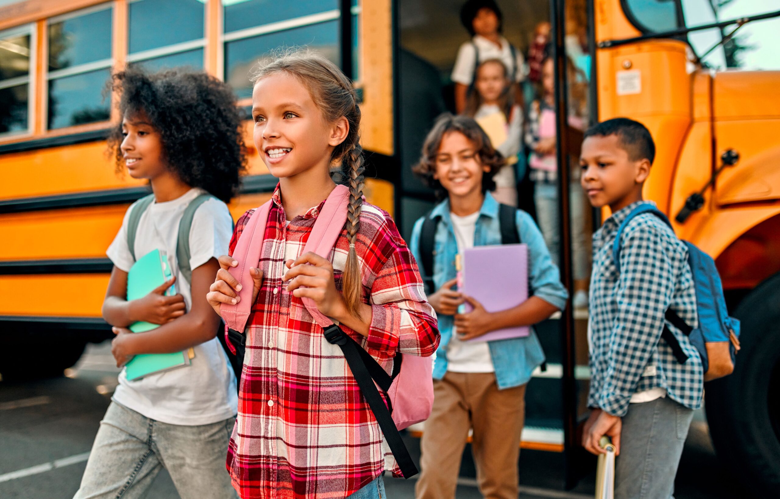 Students Getting Off School Bus.50% - Trinity Transportation Ltd.